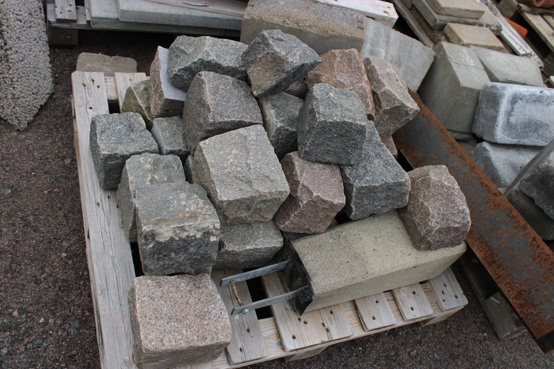 Pallets with different types of stone, tiles, paving stones etc. - PS ...