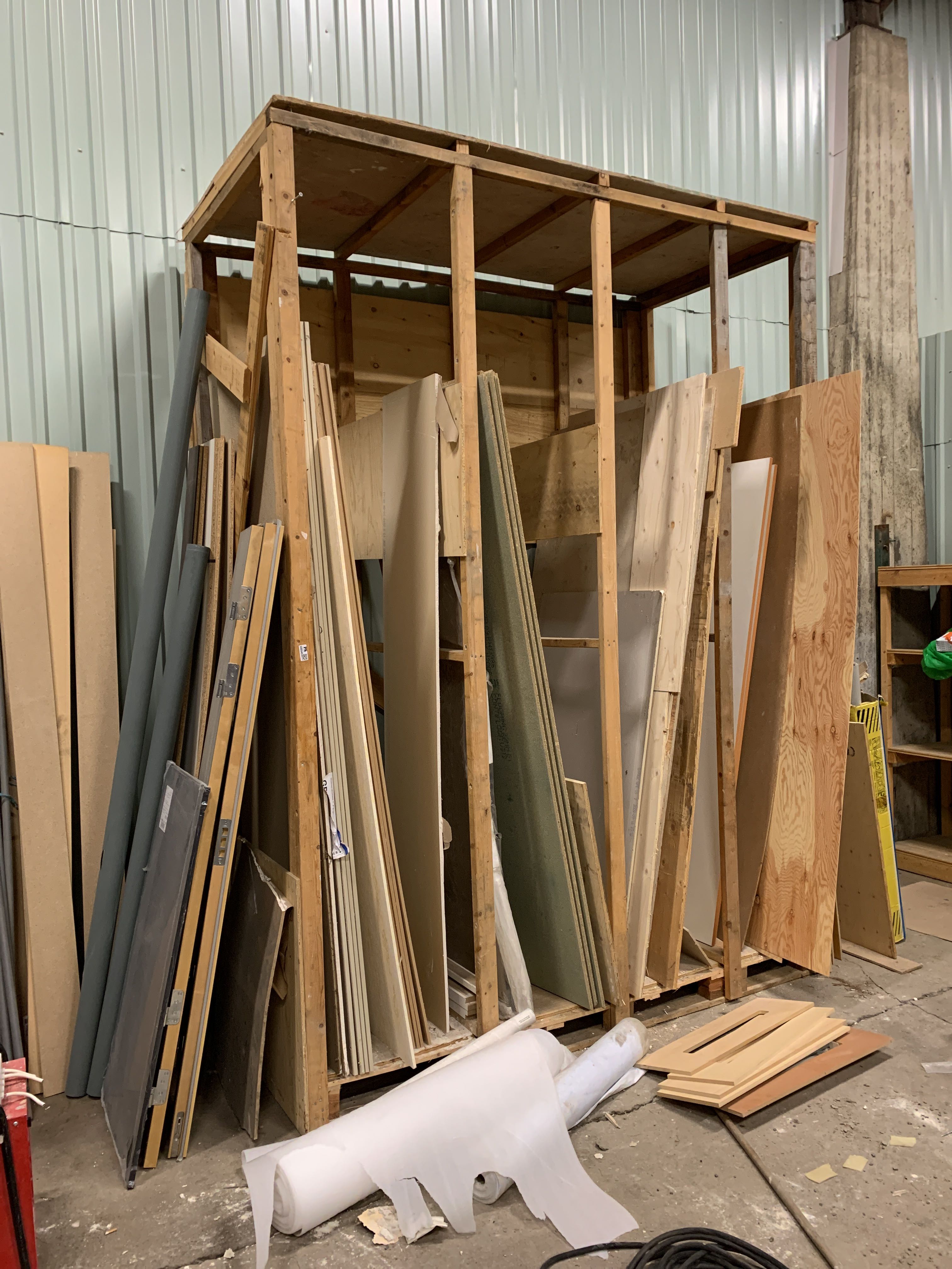 Wooden racks with mixed chipboards, plaster, plywood - PS Auction - We ...