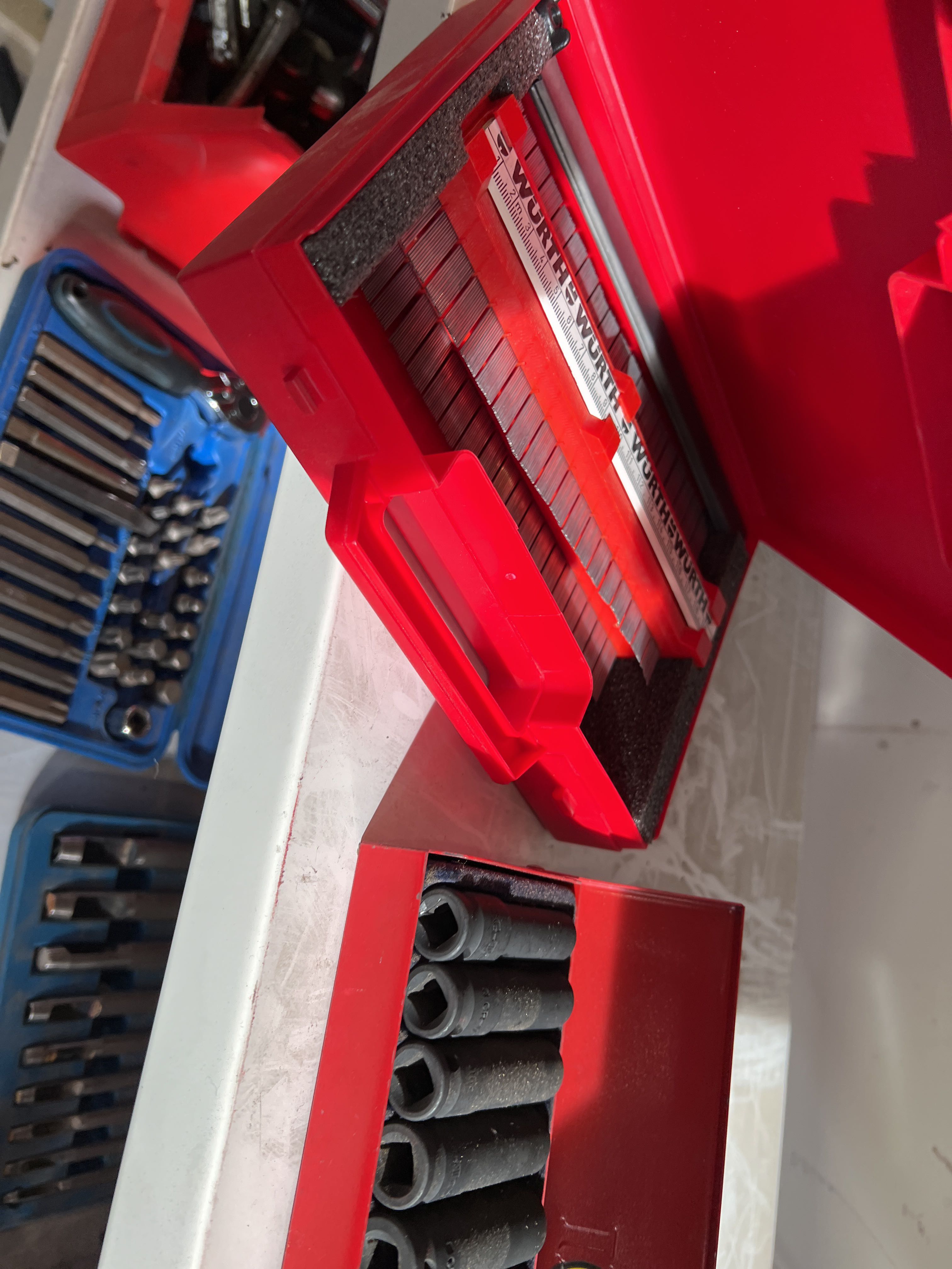 Boxes with tools, sockets, bits, pullers, torque wrenches, battery ...