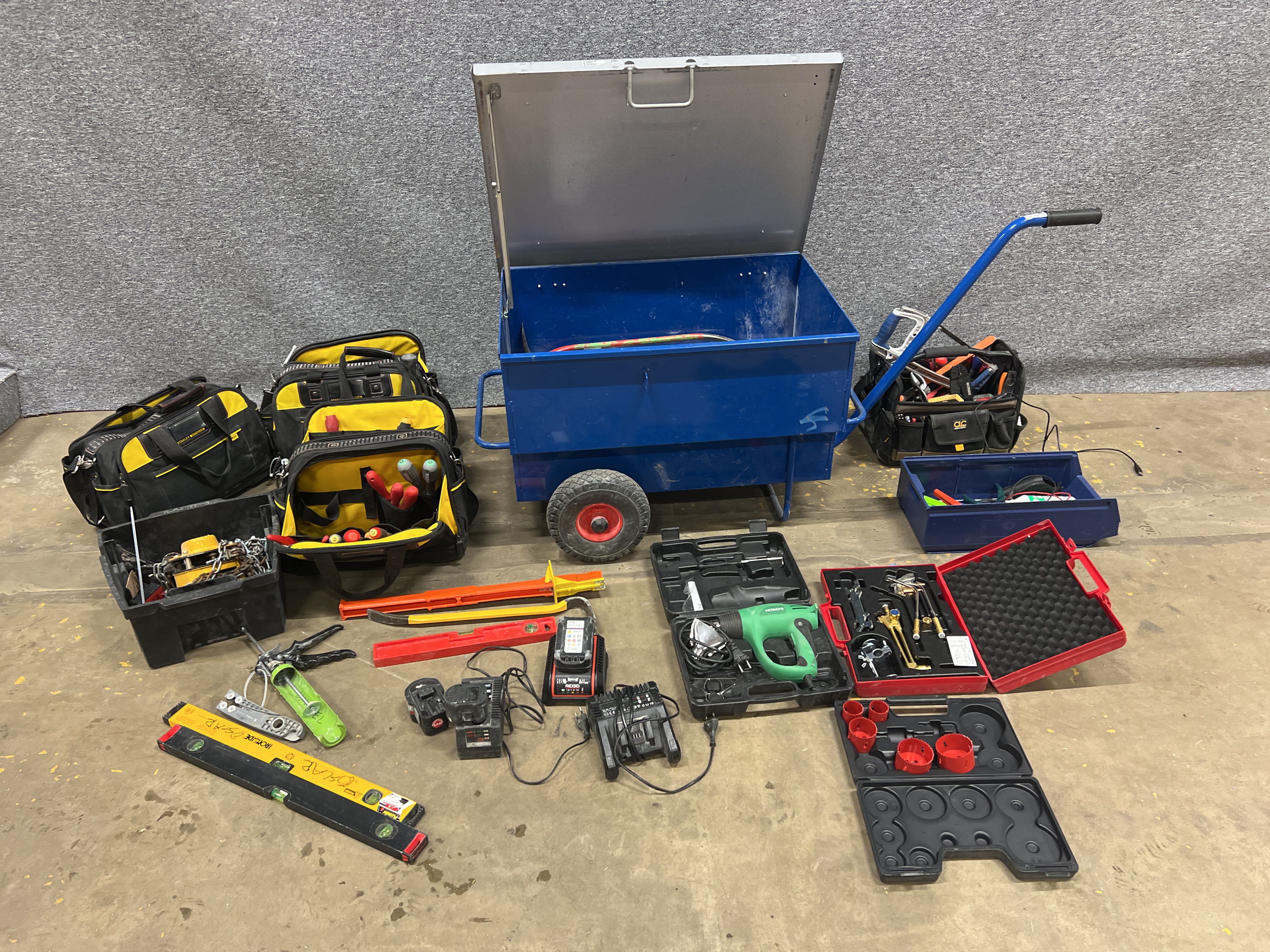 Toolbox with various tools and construction accessories - PS Auction ...