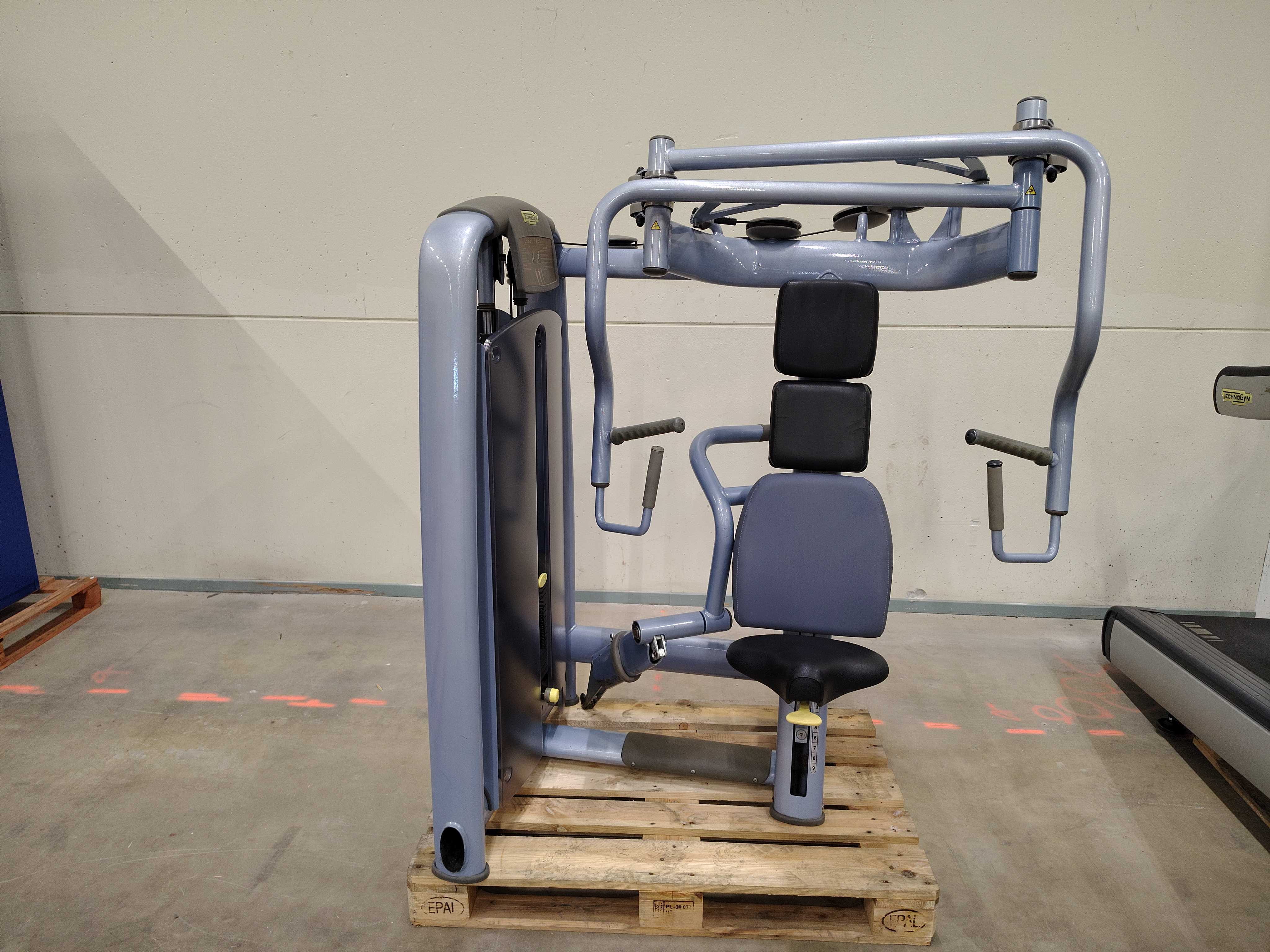 Chest press machine - Technogym - weight magazine, ergonomic handles ...