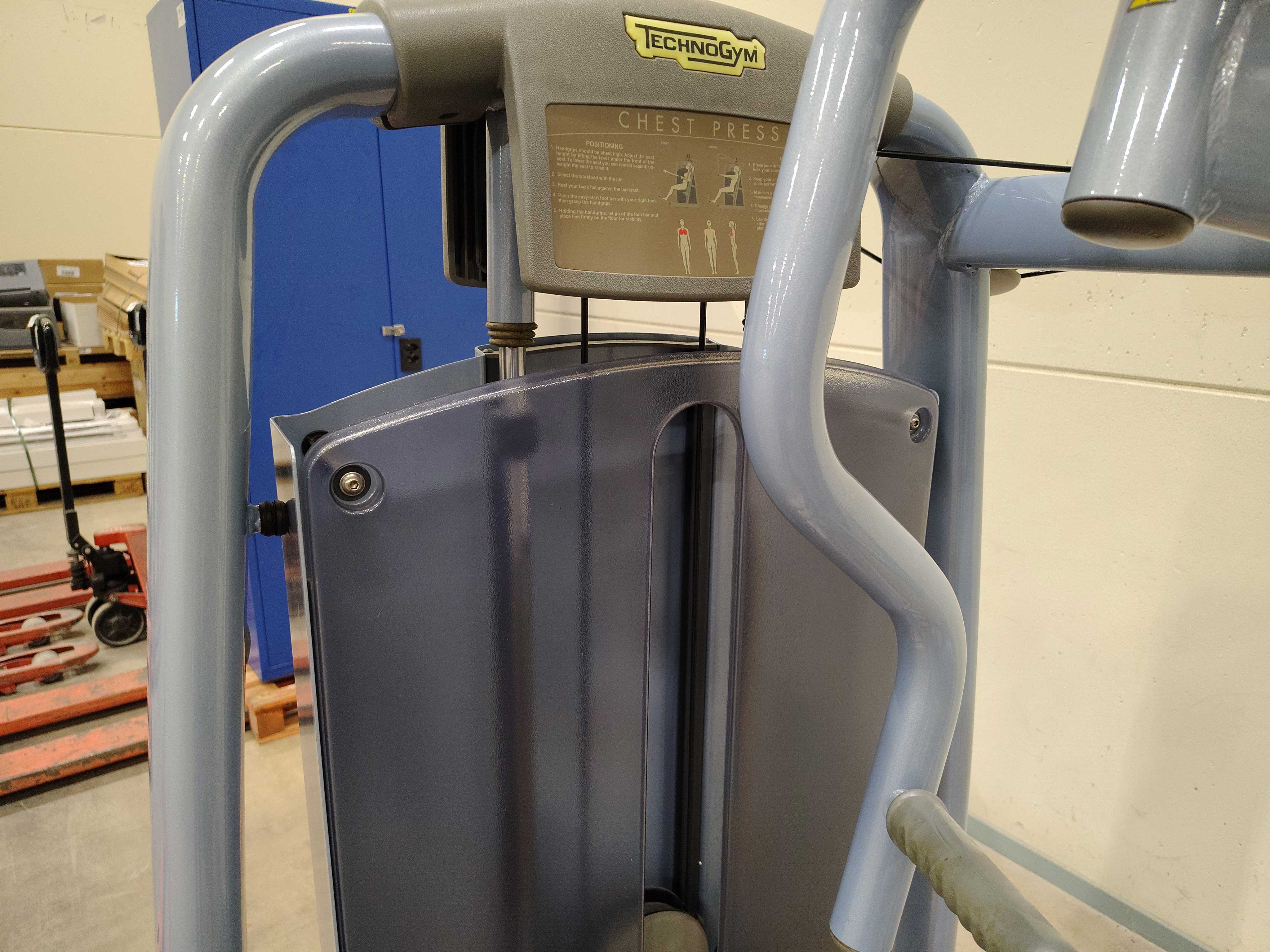 Chest press machine - Technogym - weight magazine, ergonomic handles ...