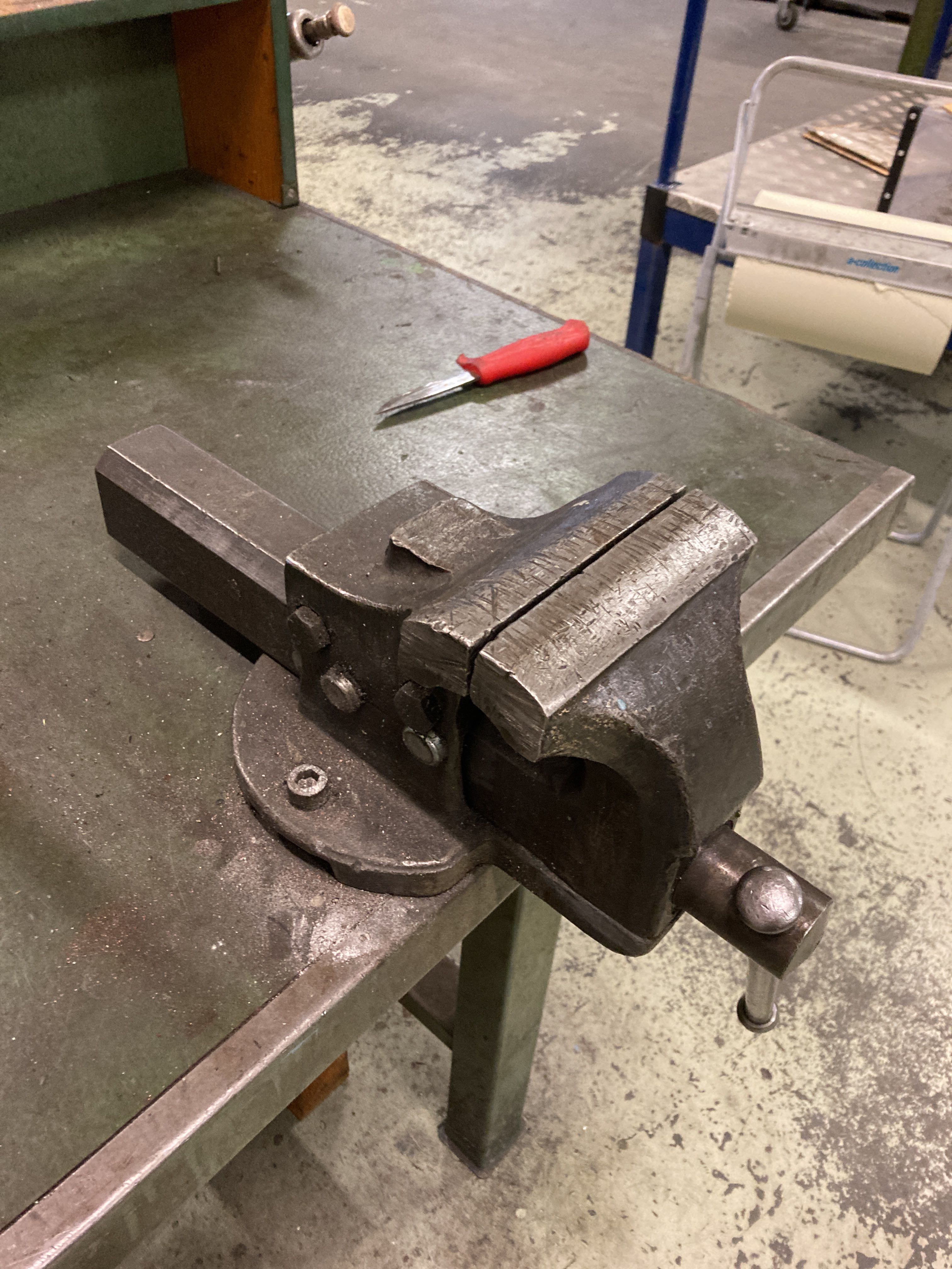 Work table with bench vise and tool board as well as pneumatic ...