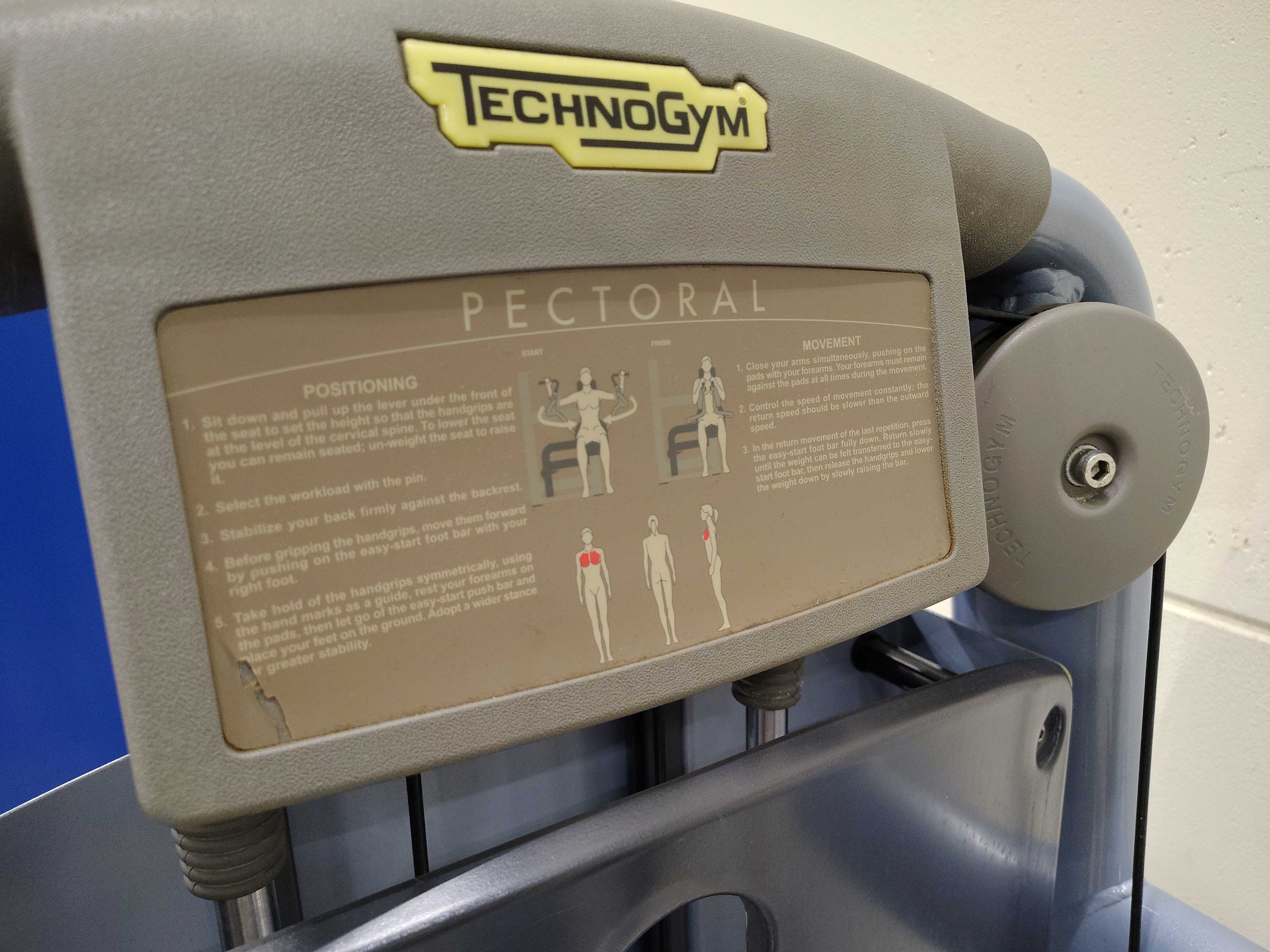 Chest training machine – Technogym, weight magazine, adjustable seat ...
