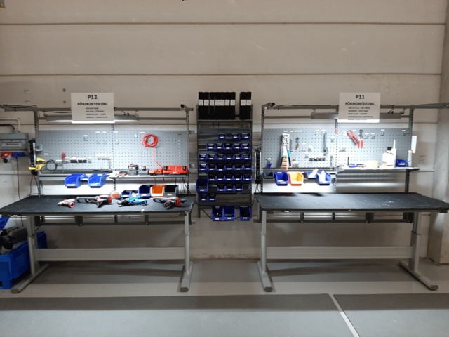 Raised/retractable workbench with tool boards, lighting and contents x2 ...